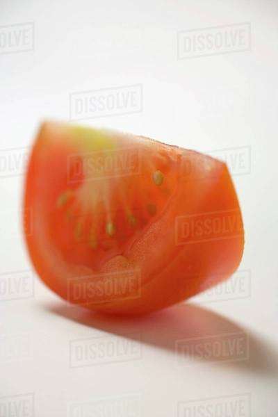 A tomato wedge - Stock Photo - Dissolve