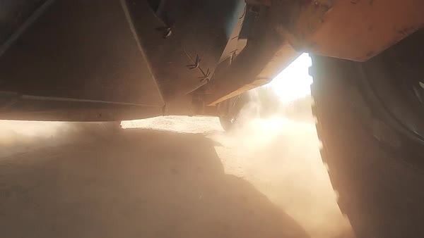 Offroad terrain with a racing car filmed from below - Stock Video Footage - Dissolve