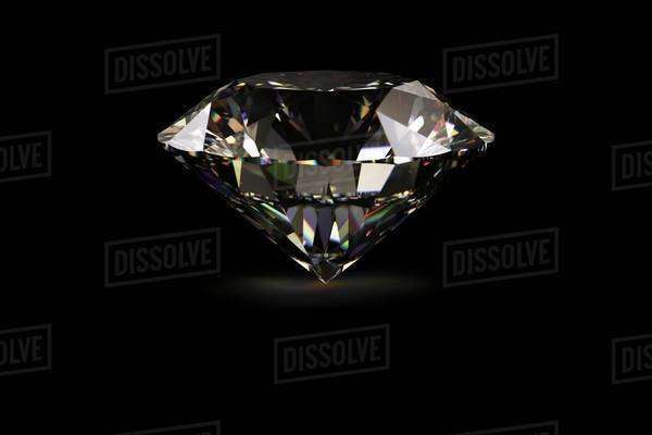 Diamond against black background - Stock Photo - Dissolve