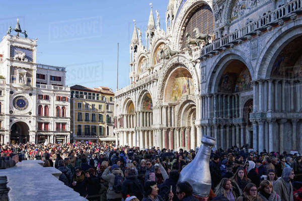 Venice, Italy Saint Mark square with crowd during carnival. Basilica di San Marco facade with ...