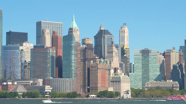 Iconic view of Lower Manhattan business district skyline from the vantage point on Hudson River ...