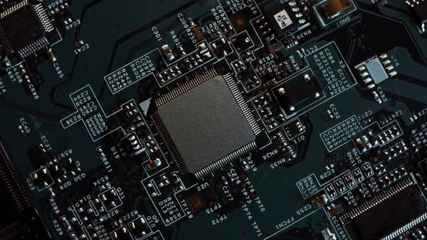 Focus on a Microchip, CPU Processor. Black Printed Circuit Board, Computer Motherboard with ...