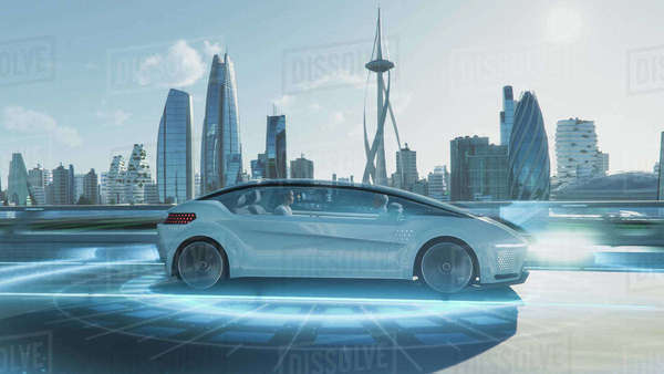 Shot of a Futuristic Self-Driving Van Moving on a Public Highway in a Modern City with Glass ...