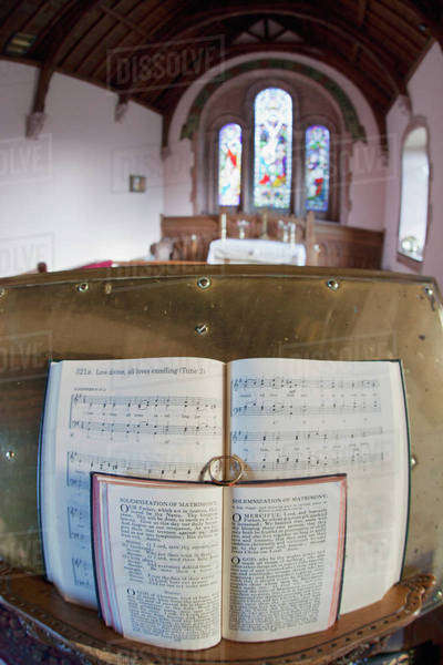 An Open Hymnal And Bible On A Podium Inside A Church; Northumberland ... An Open Hymnal And Bible On A Podium Inside A Church; Northumberland ...