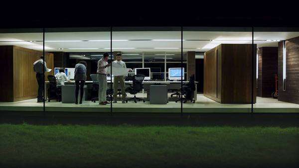 Office people walk between corporate floors in glass building - Stock ...