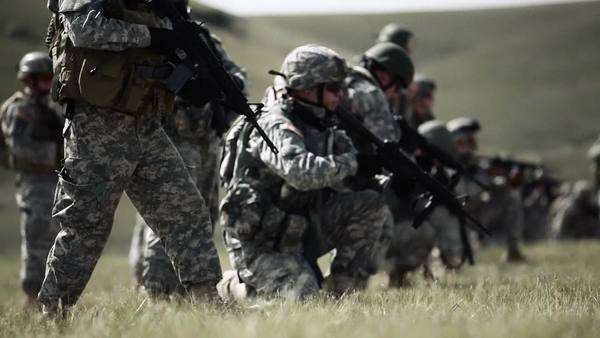 Static shot of soldiers practicing kneeling stance. At Green Beret ...