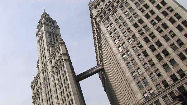 Chicago's landmark Wrigley Building towers are connected by a walkway ...