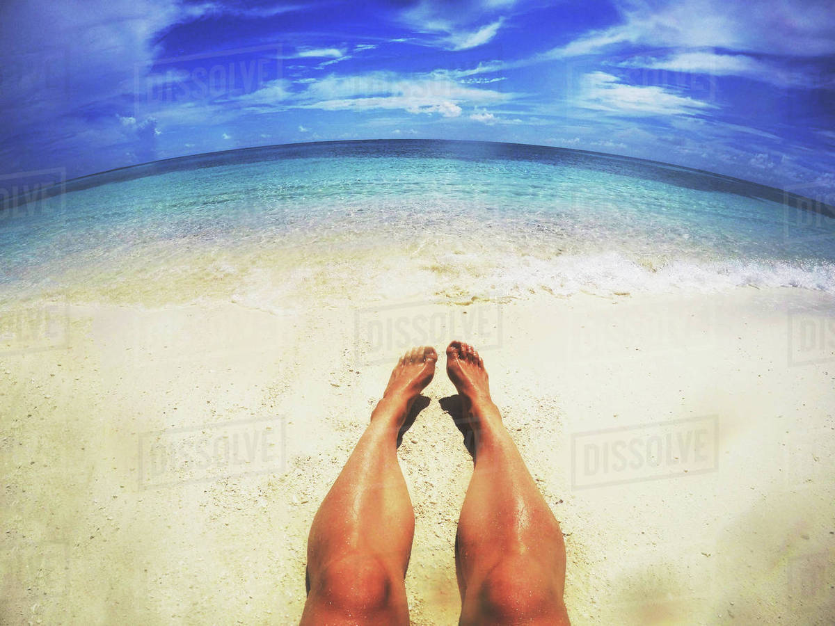 Man sunbathing on sunny tropical beach - Royalty-free Stock Photo ...