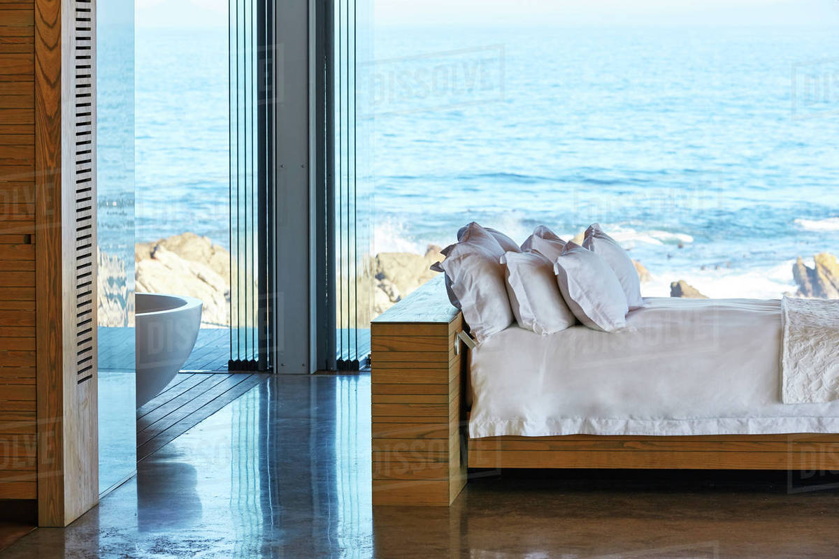 Modern luxury home showcase bed with ocean view - Stock Photo - Dissolve