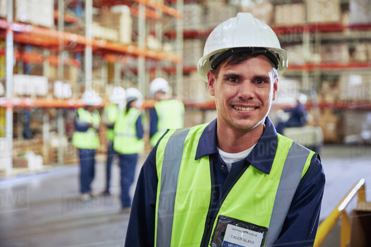Portrait smiling worker in distribution warehouse - Royalty-free Stock ...