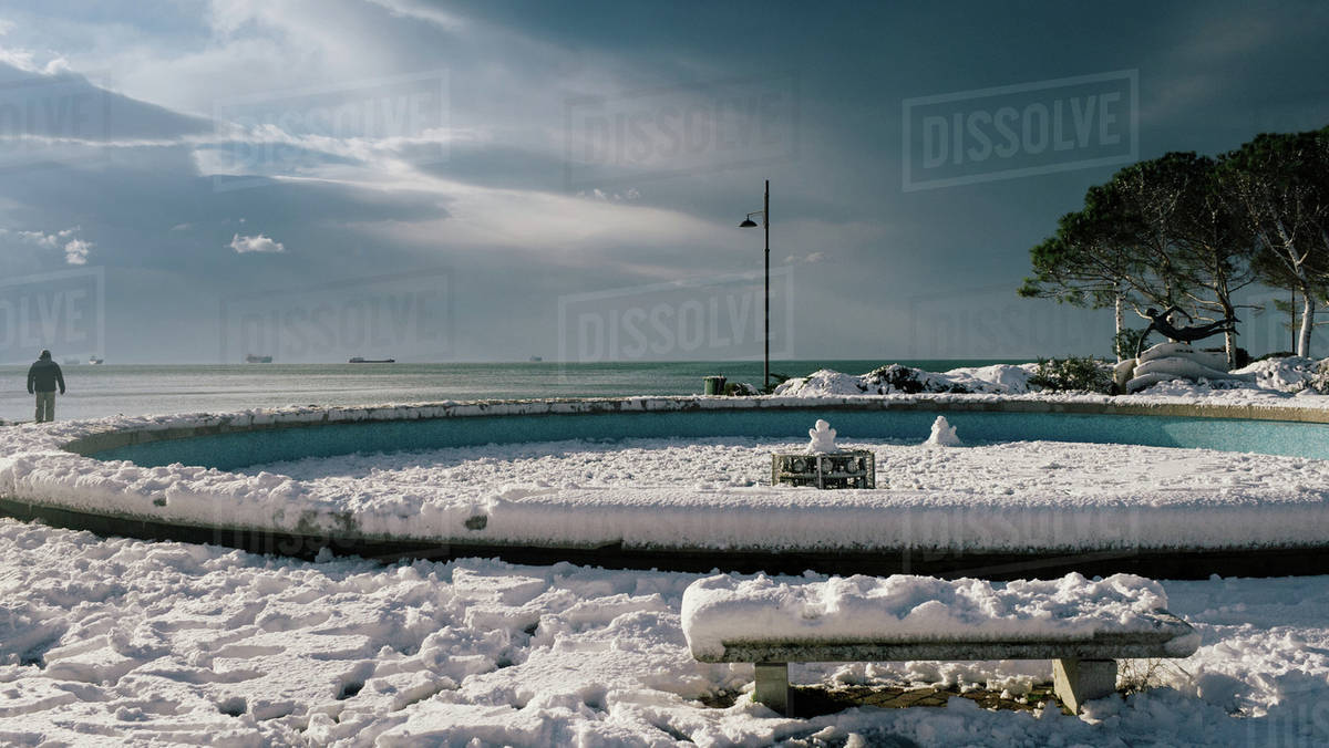 Snow-covered fountain in Trieste, Italy - Stock Photo - Dissolve