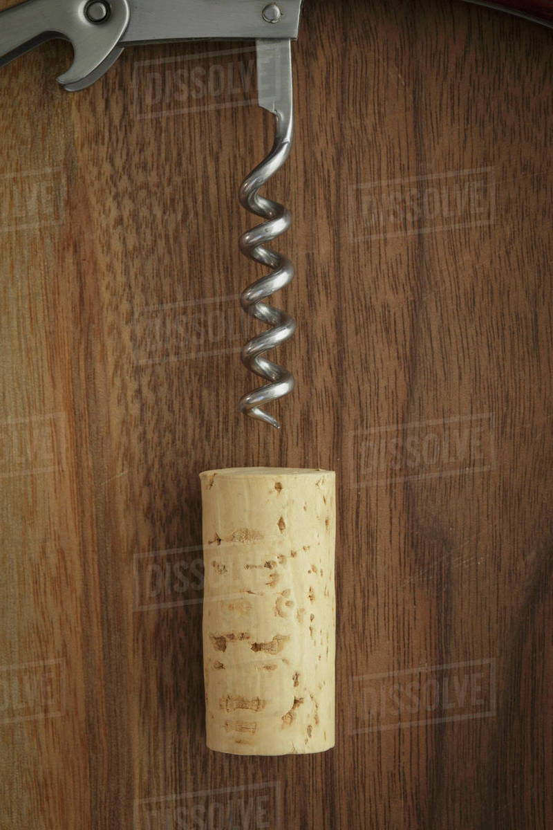Corkscrew with cork - Stock Photo - Dissolve