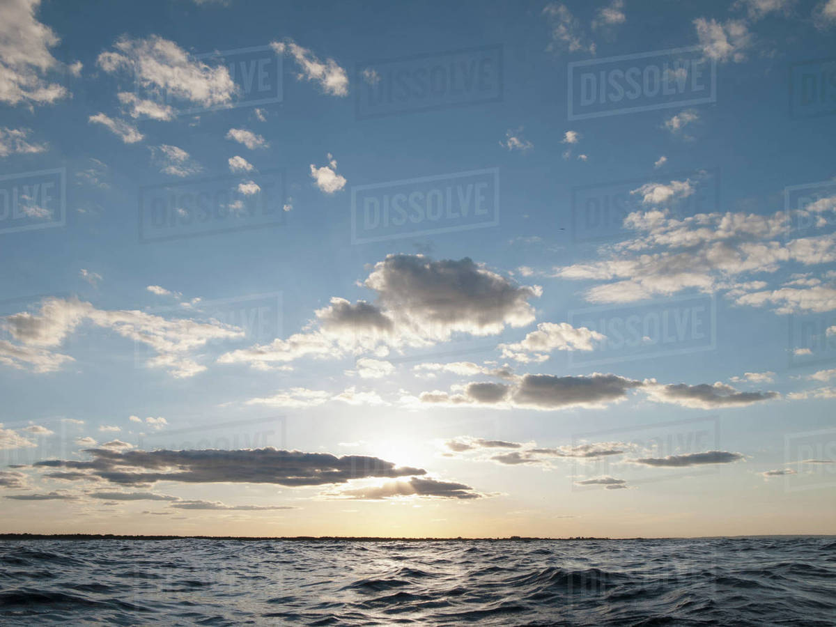 Moody sky over sea - Stock Photo - Dissolve