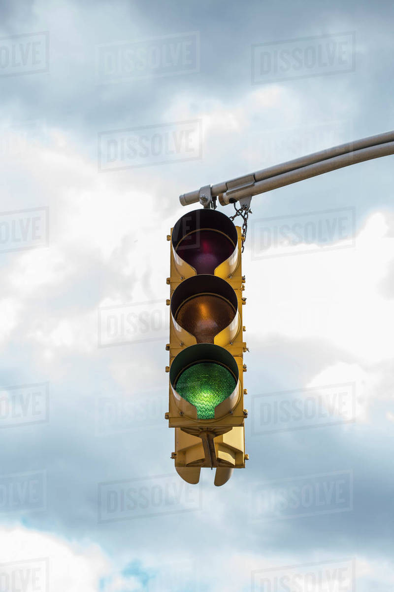 Traffic light against storm clouds - Royalty-free Stock Photo | Dissolve