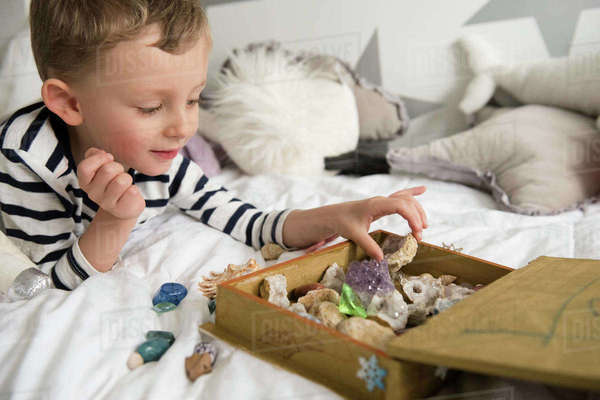 Little boy (4-5) with box full of treasures - Royalty-free Stock Photo ...