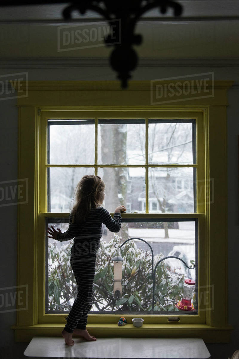 Girl by window - Stock Photo - Dissolve