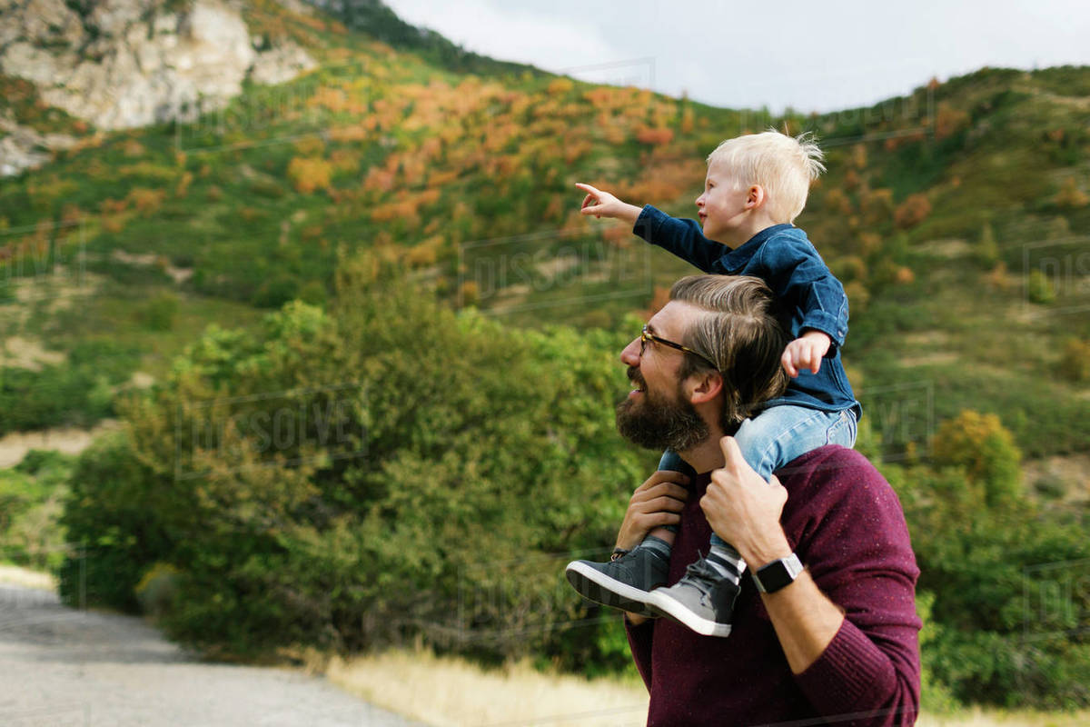 Father giving son piggyback ride - Royalty-free Stock Photo | Dissolve