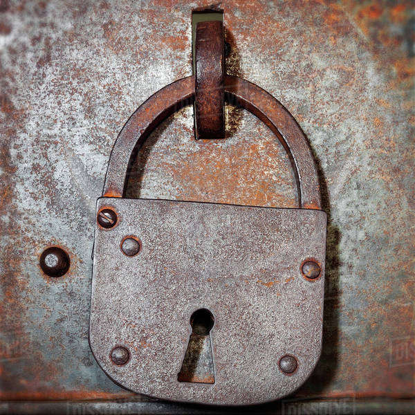 Antique rusted padlock - Stock Photo - Dissolve