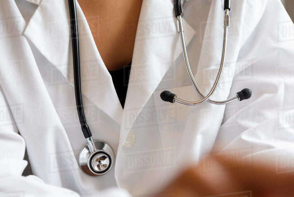 Stethoscope around doctor's neck - Stock Photo - Dissolve