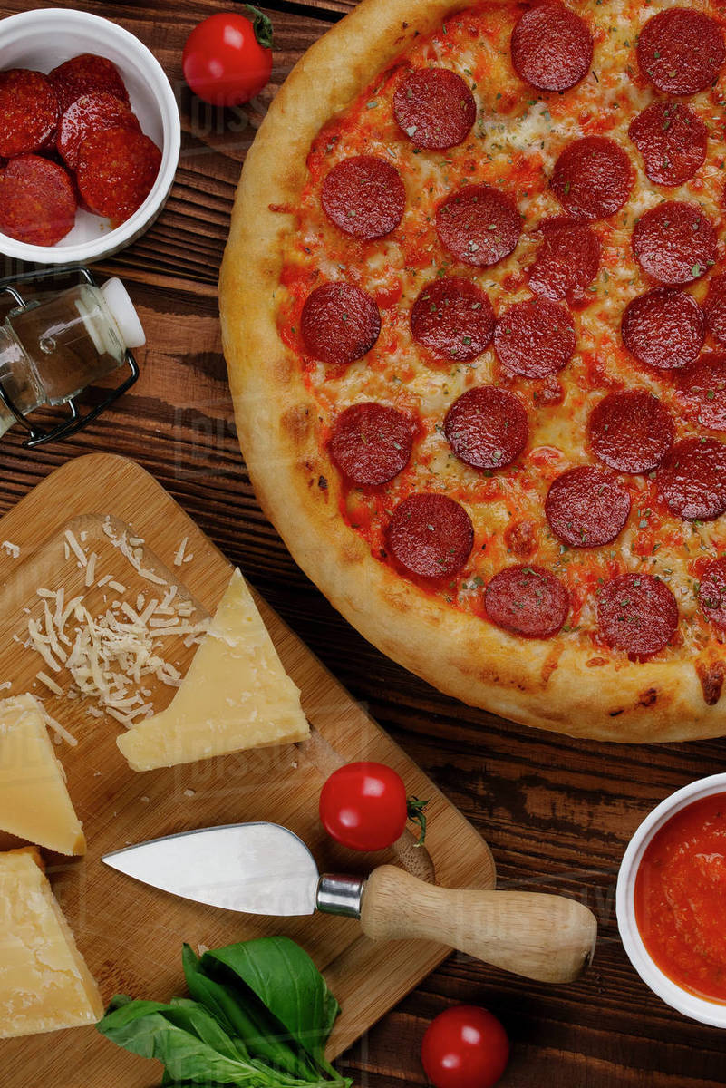 Pepperoni pizza with ingredients - Royalty-free Stock Photo | Dissolve