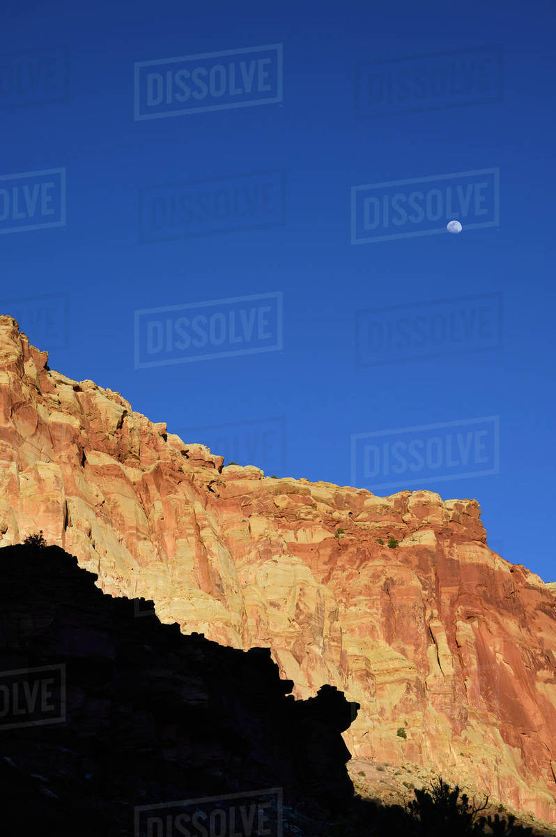 Moon over cliff in shadow in Capitol Reef National Park, USA - Royalty ...