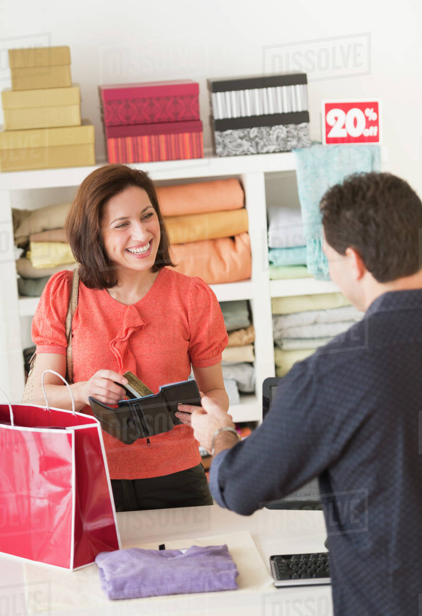 Customer paying in store - Royalty-free Stock Photo | Dissolve