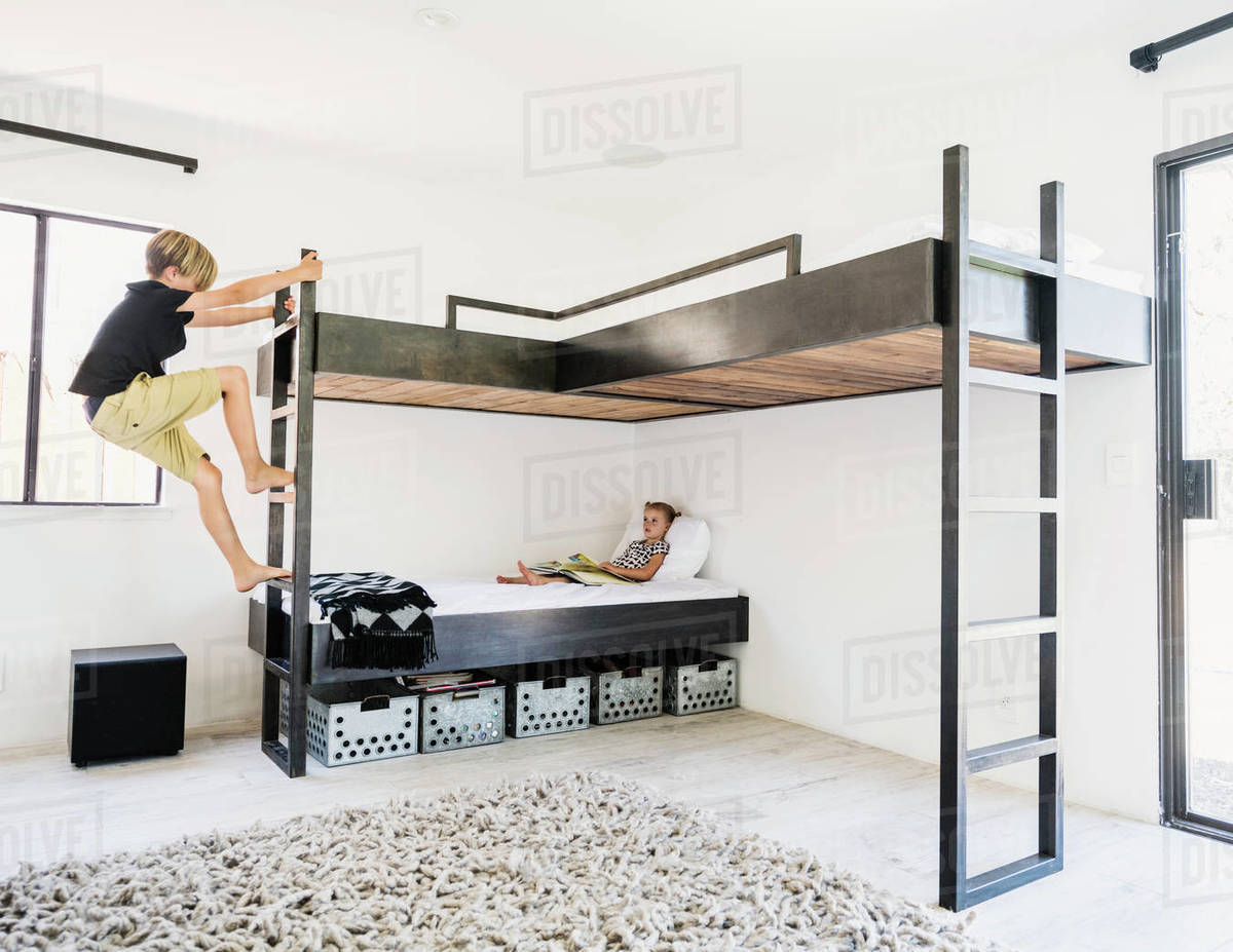 Siblings on bunk beds - Stock Photo - Dissolve