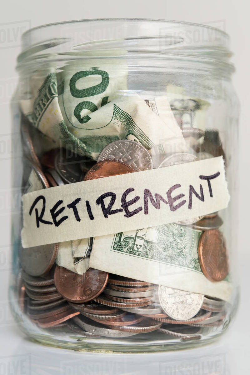 Money in jar labeled 'retirement' - Stock Photo - Dissolve