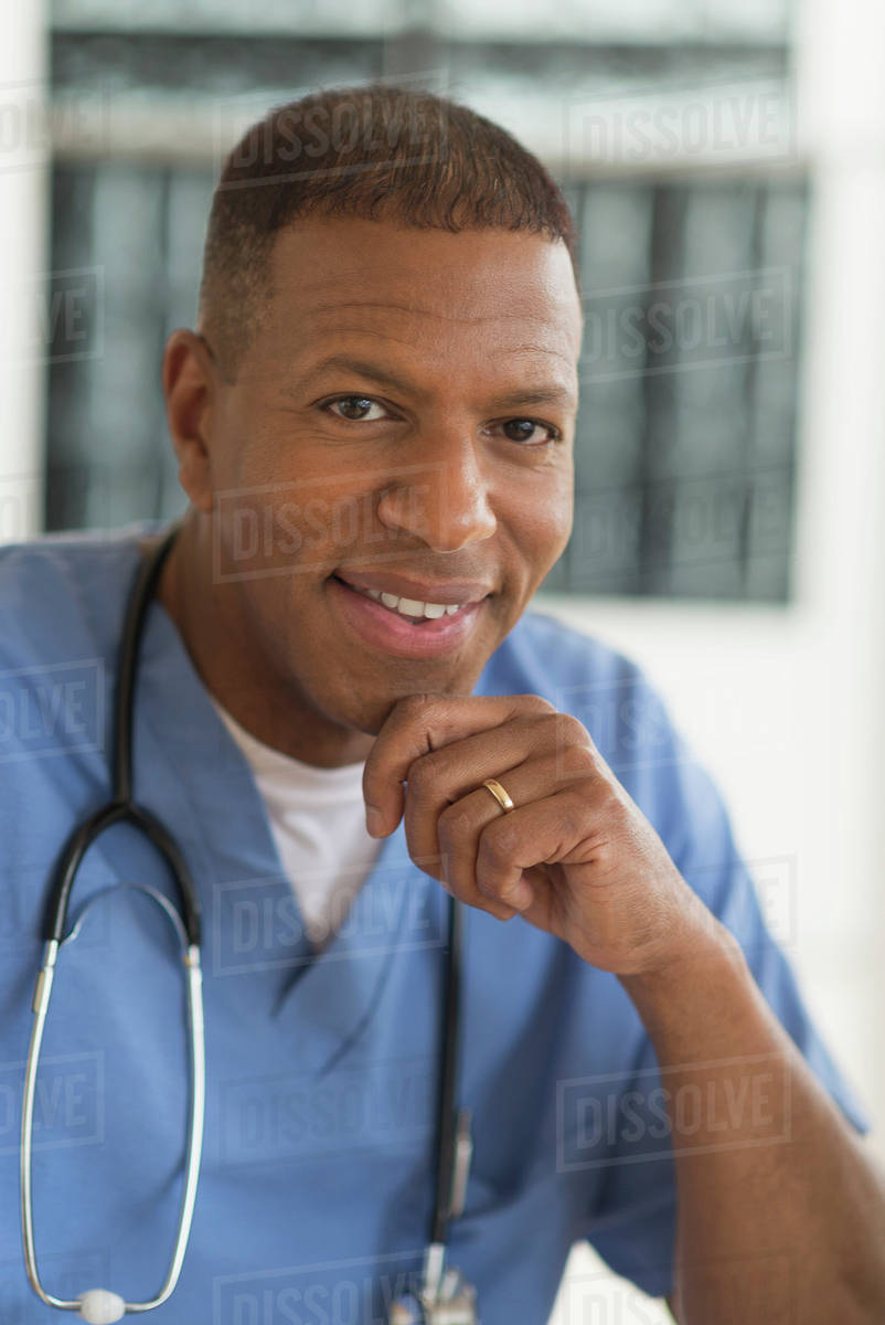 Portrait of male doctor in hospital - Stock Photo - Dissolve
