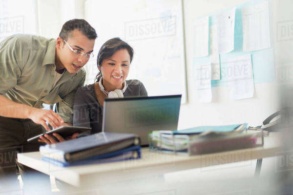 Two people working together with laptop - Royalty-free Stock Photo ...