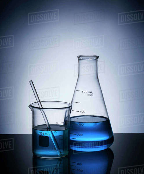 Blue liquid in beakers - Royalty-free Stock Photo | Dissolve