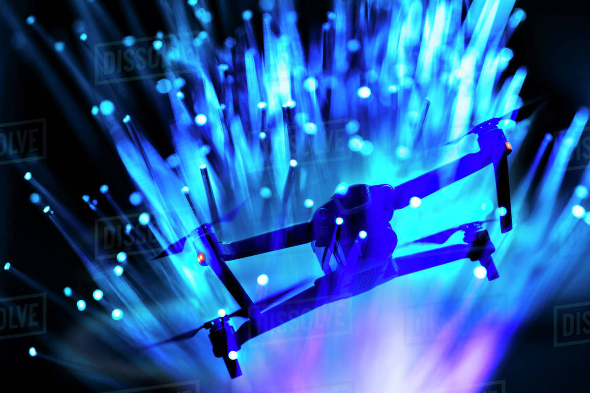Double exposure of drone and fiber optic cables - Stock Photo - Dissolve