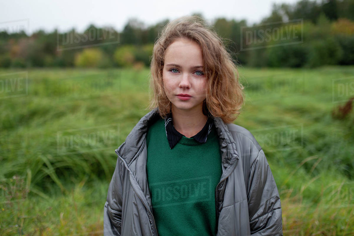 Russia, Omsk, Portrait of teenage girl in meadow - Royalty-free Stock ...