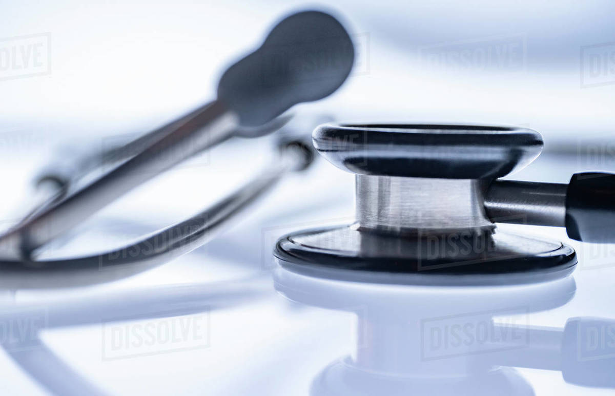 Close-up of stethoscope on white - Royalty-free Stock Photo | Dissolve