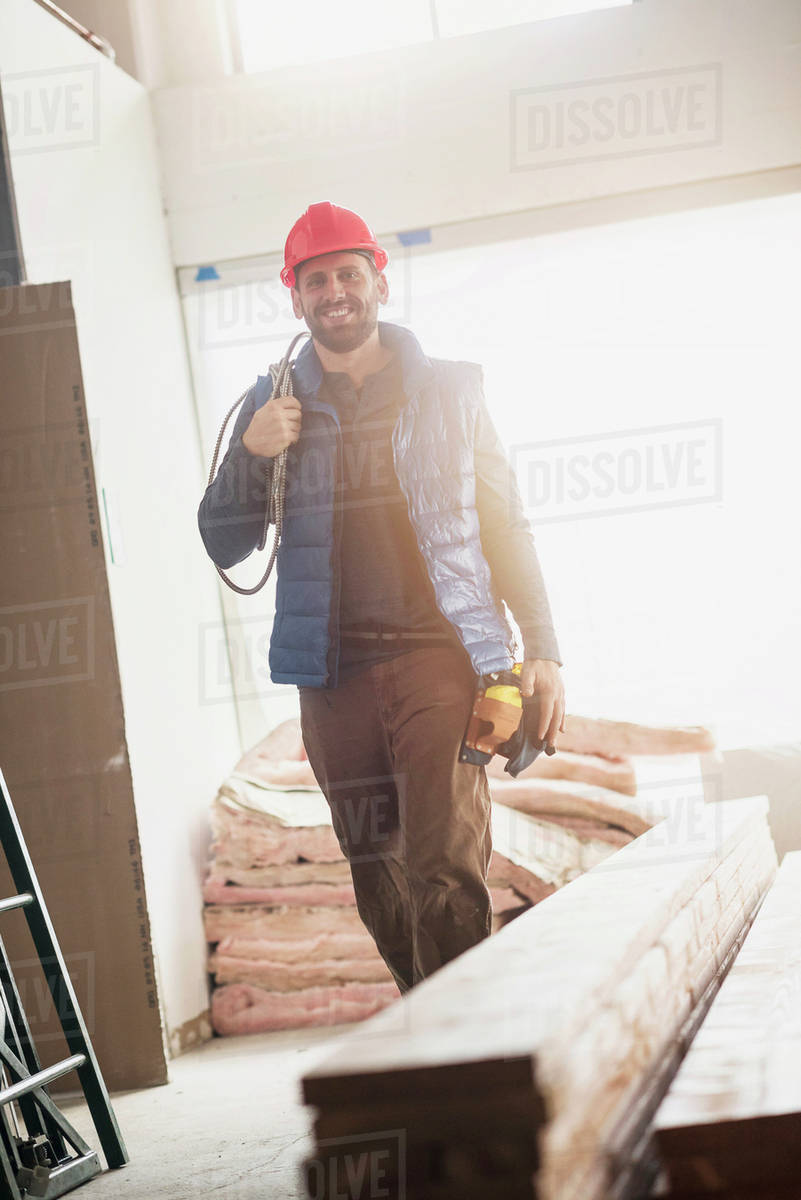 Smiling construction worker - Royalty-free Stock Photo | Dissolve