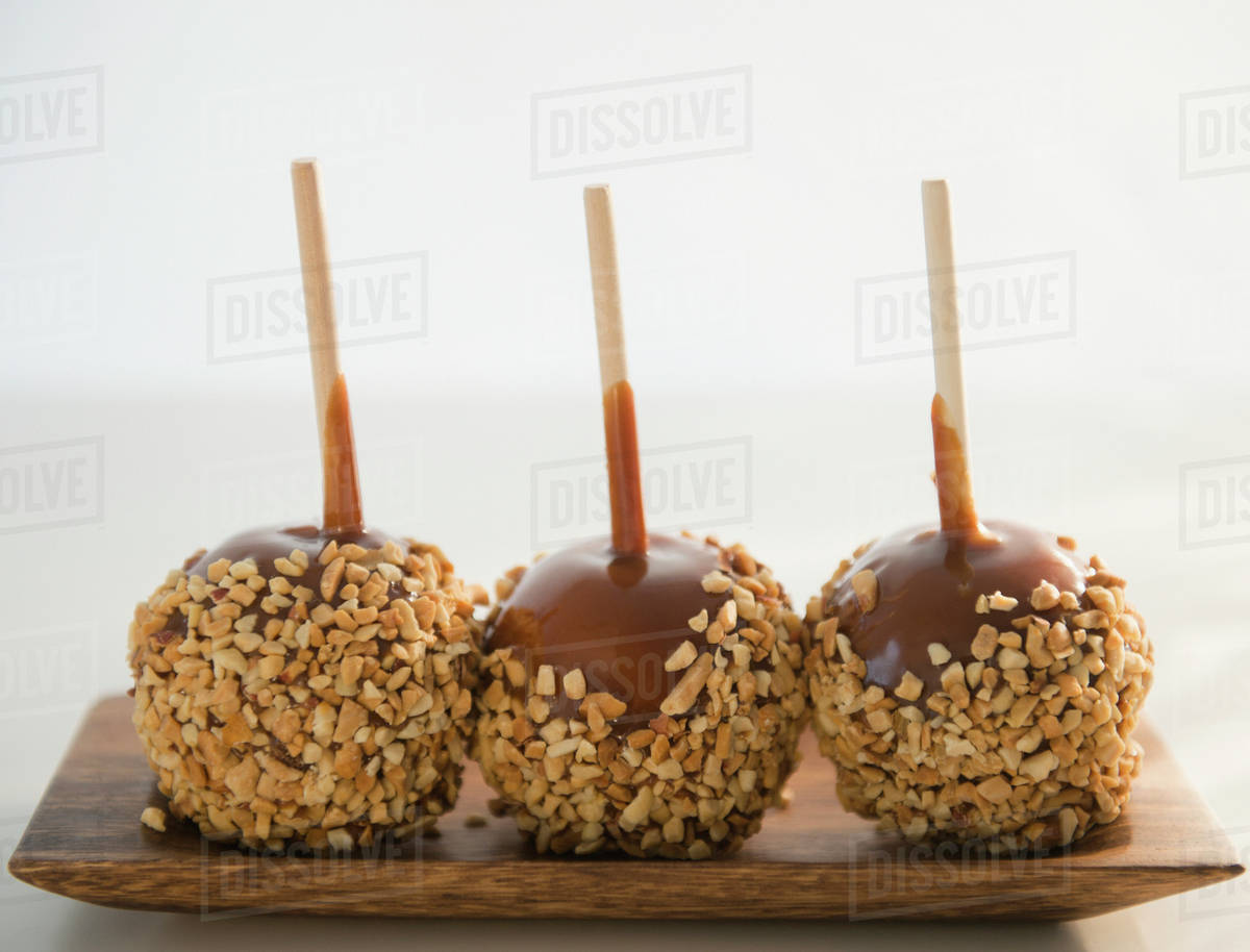 Studio Shot of caramel apples - Stock Photo - Dissolve