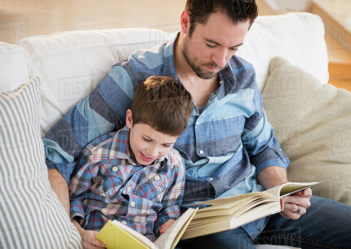 Father reading books with his son (8-9) - Royalty-free Stock Photo ...