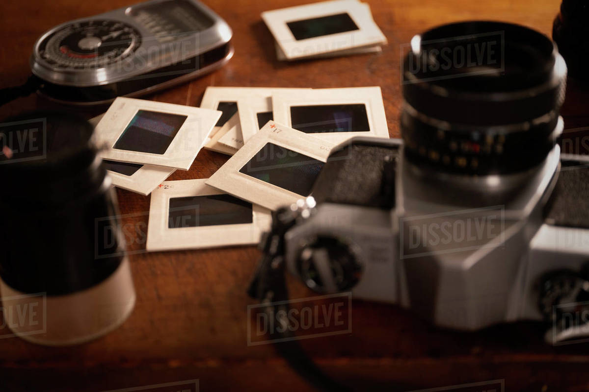 Analog camera, slides and light meter - Royalty-free Stock Photo | Dissolve