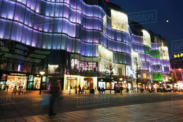 Modern urban building lit up at night - Royalty-free Stock Photo | Dissolve