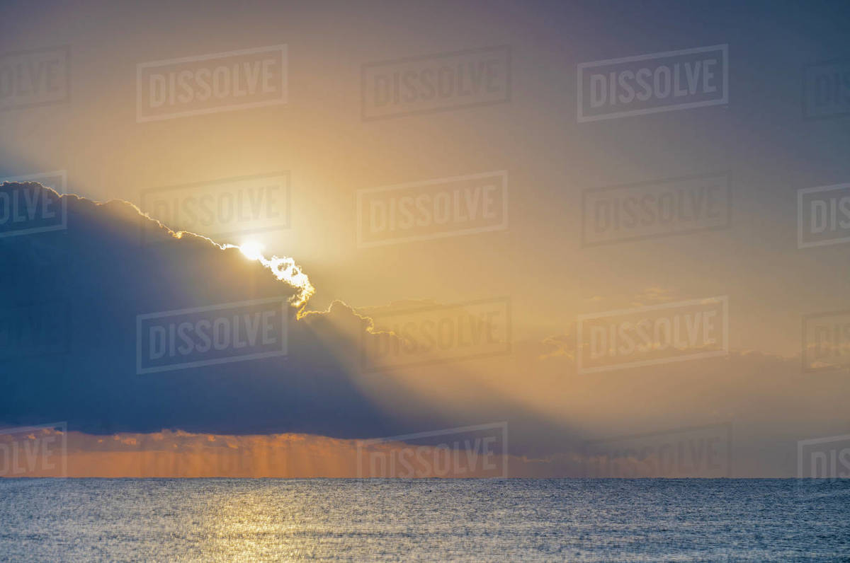 USA, Florida, Boca Raton, Sun rising behind clouds above sea - Stock ...