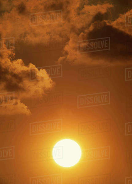 Setting sun among clouds - Royalty-free Stock Photo | Dissolve