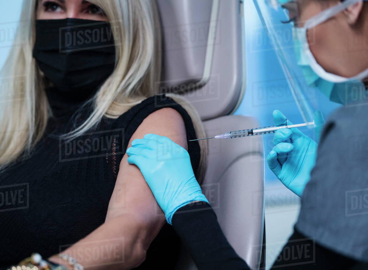 Patient receiving injection - Royalty-free Stock Photo | Dissolve