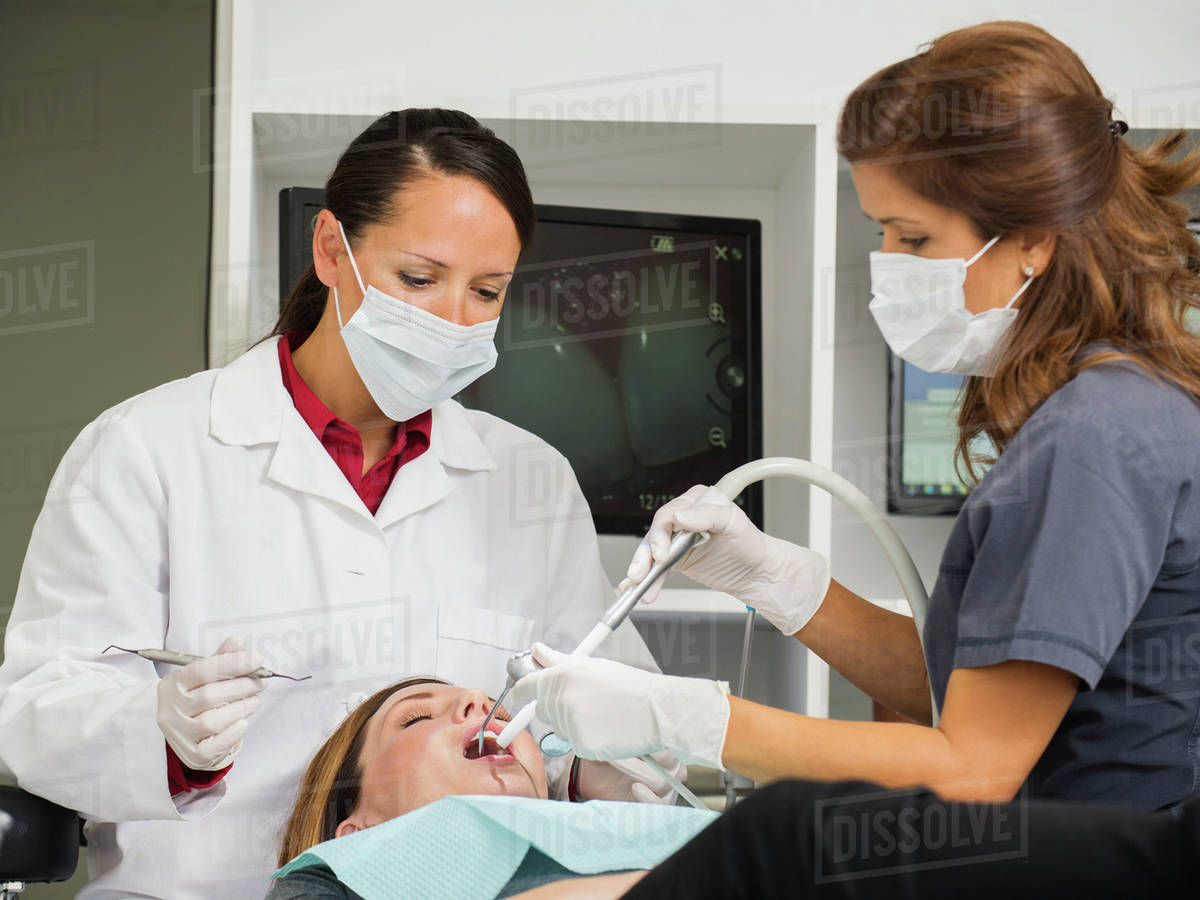 Dentist operation on patient - Royalty-free Stock Photo | Dissolve