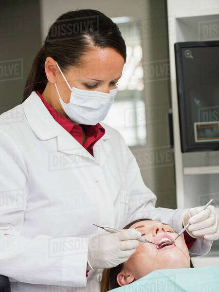 Dentist operation on patient - Stock Photo - Dissolve