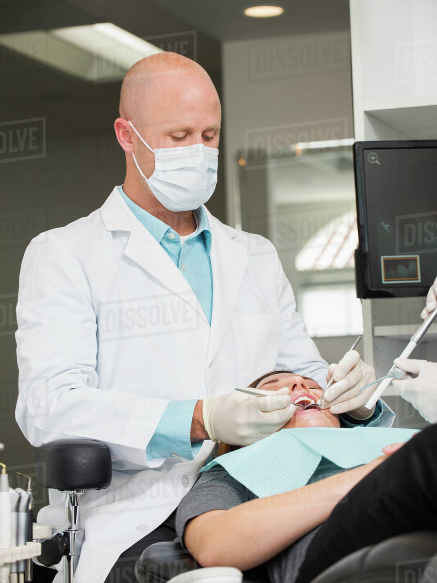 Dentist operation on patient - Royalty-free Stock Photo | Dissolve