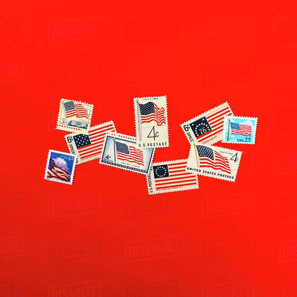 Retro postage stamps against red background - Stock Photo - Dissolve