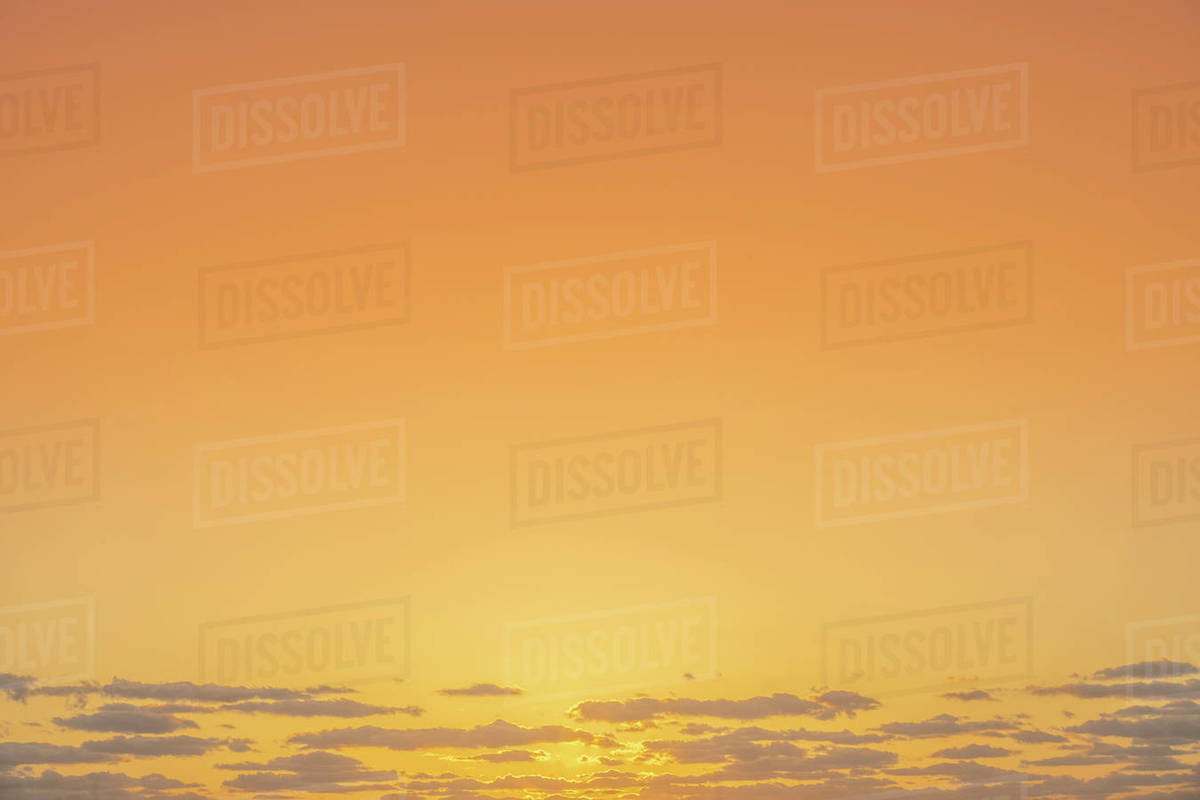 Golden sunrise sky with low clouds - Royalty-free Stock Photo | Dissolve