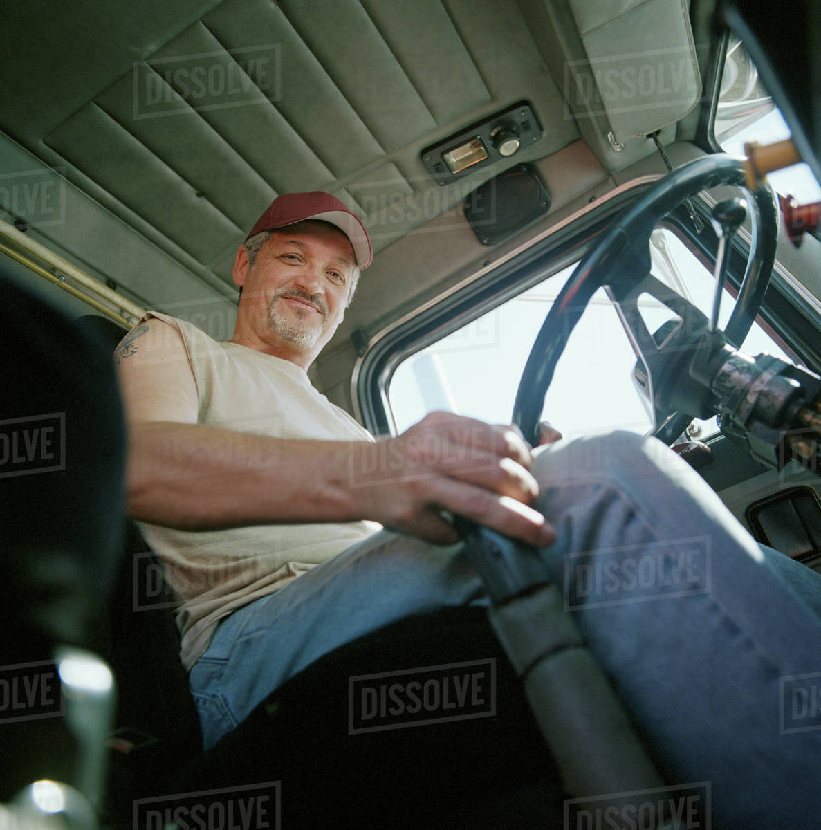 Portrait of happy truck driver - Stock Photo - Dissolve