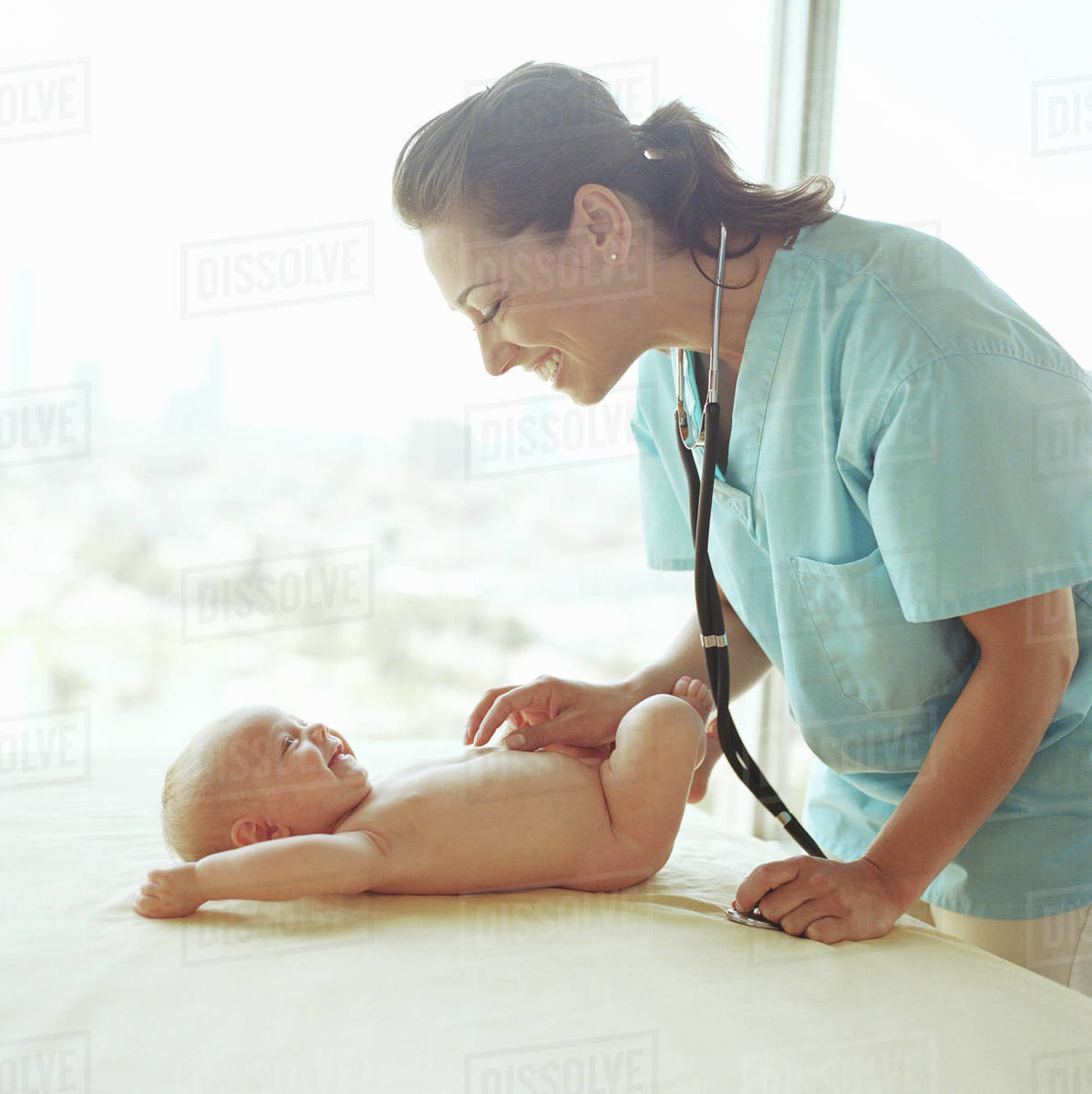 Doctor examining baby girl (2-5 months) - Royalty-free Stock Photo ...