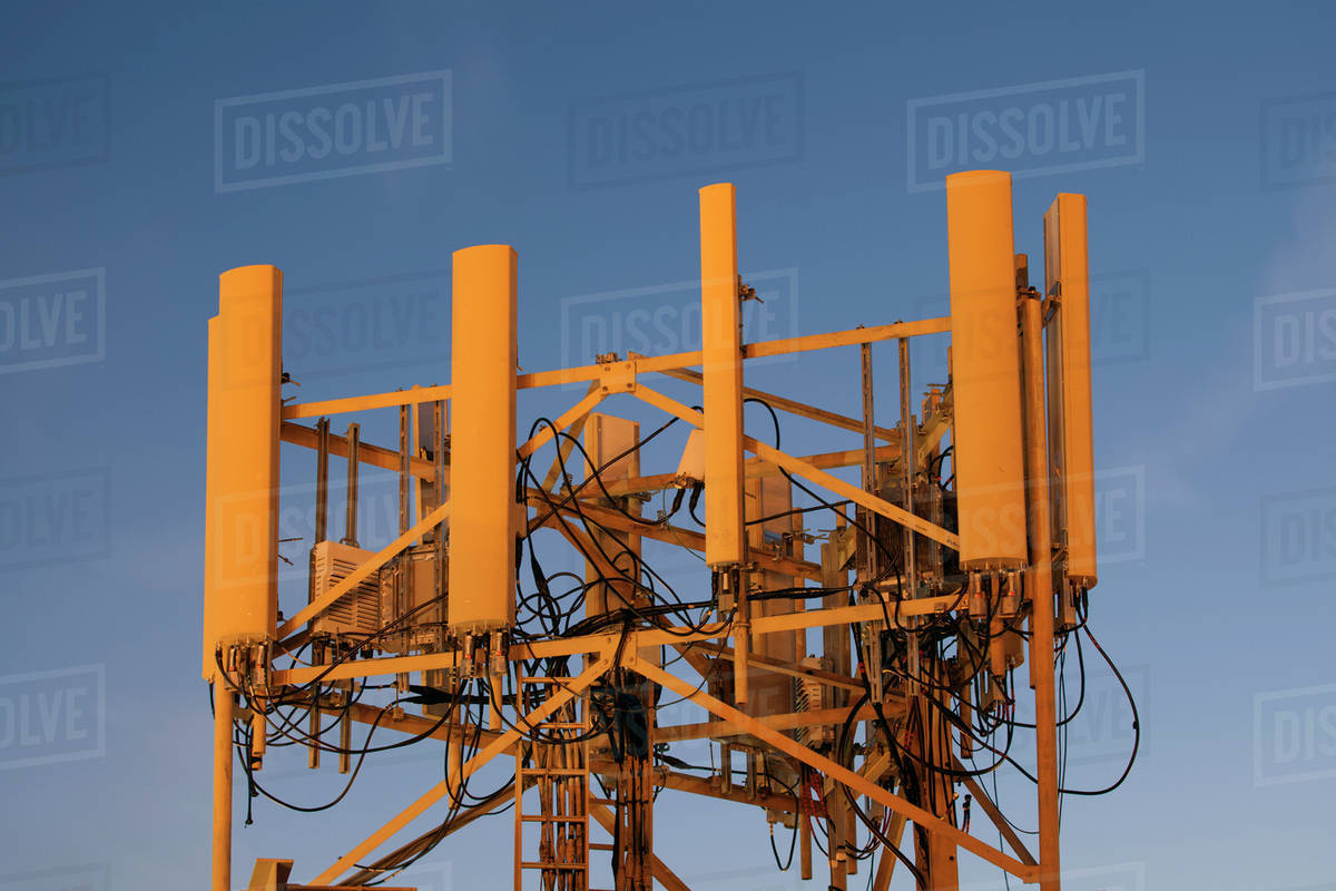 Mobile phone tower on evening sky - Royalty-free Stock Photo | Dissolve